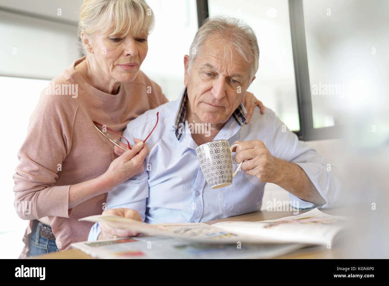 Reading newspaper together hi-res stock photography and images - Alamy