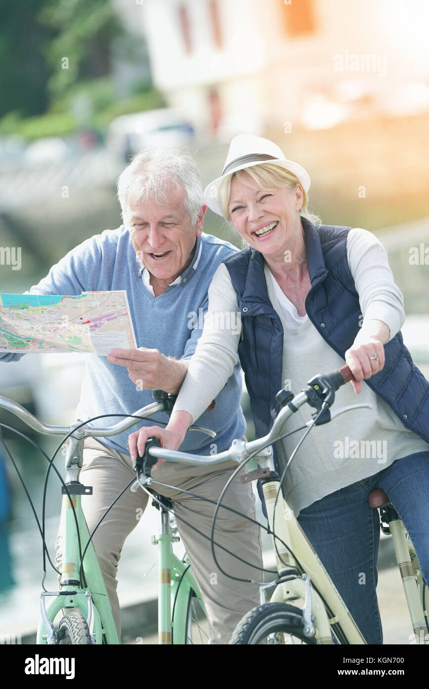 Elderly woman riding bicycle hi-res stock photography and images - Alamy