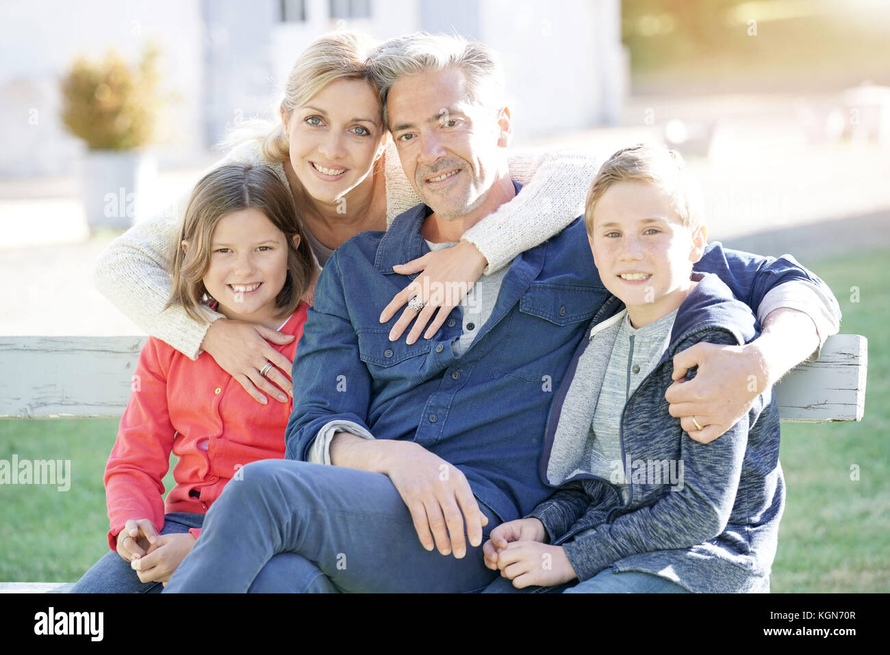 Couple children sitting on bench hi-res stock photography and images ...