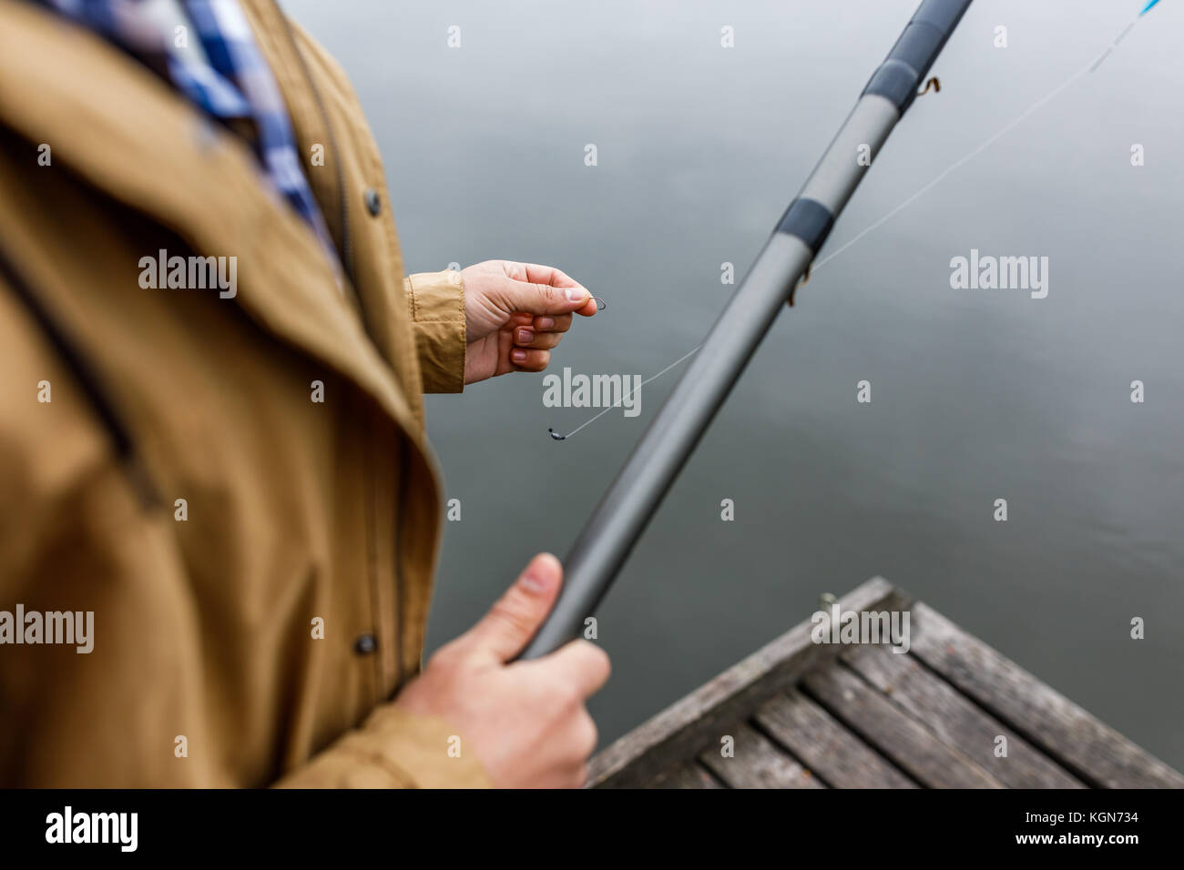 man with fishing rod and hook Stock Photo - Alamy