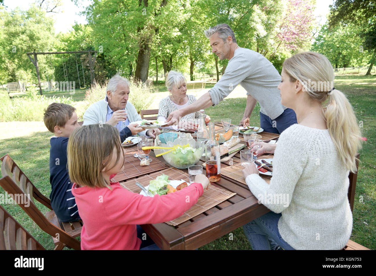 Family having summer lunch in garden Stock Photo - Alamy