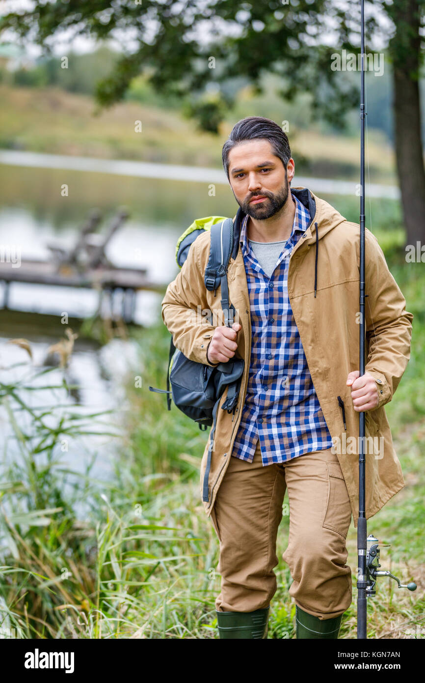 fisherman with fishing rod Stock Photo - Alamy