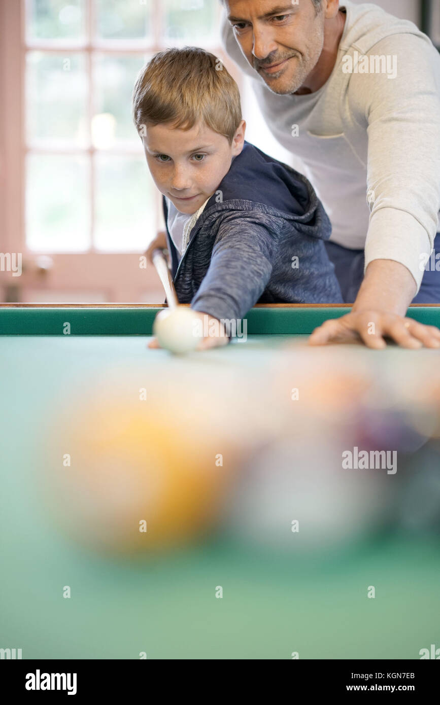 Father and son playing pool together Stock Photo - Alamy