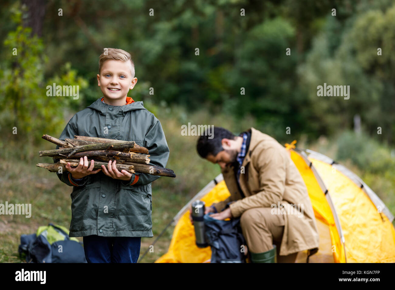 Holding sticks camp hi-res stock photography and images - Alamy