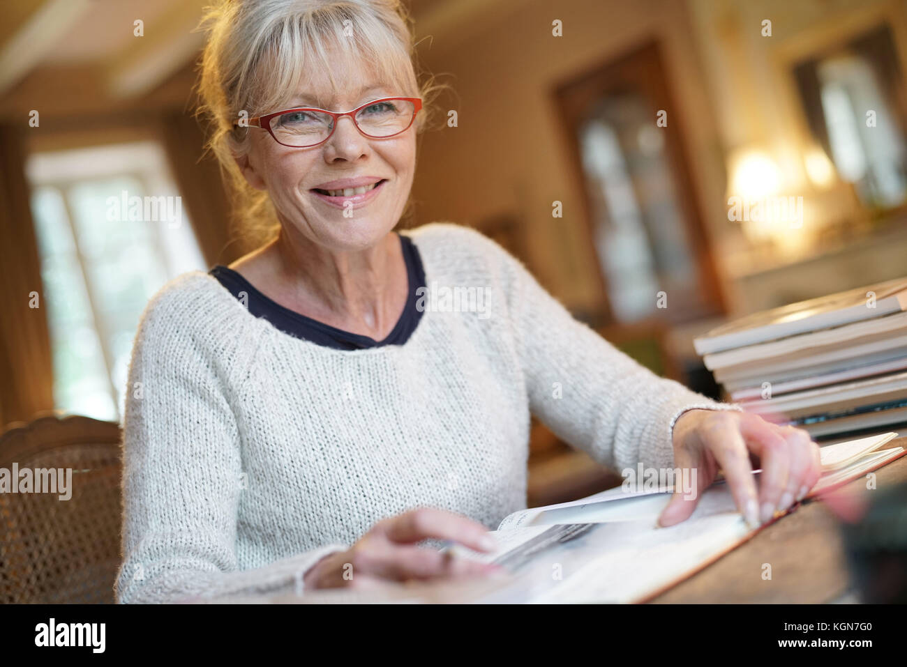 Retired woman writing hi-res stock photography and images - Alamy