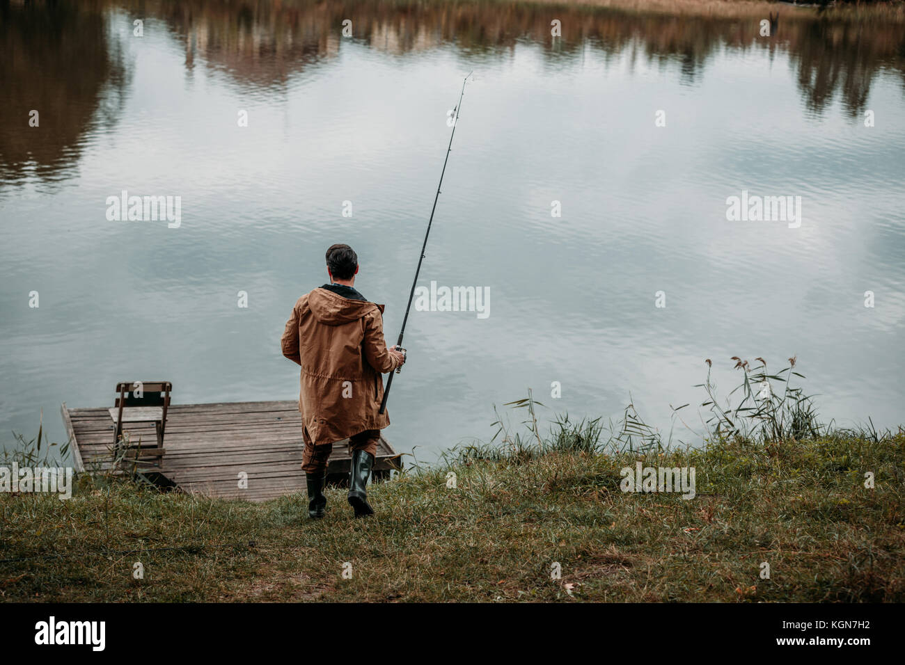 fisherman fishing with rod Stock Photo - Alamy