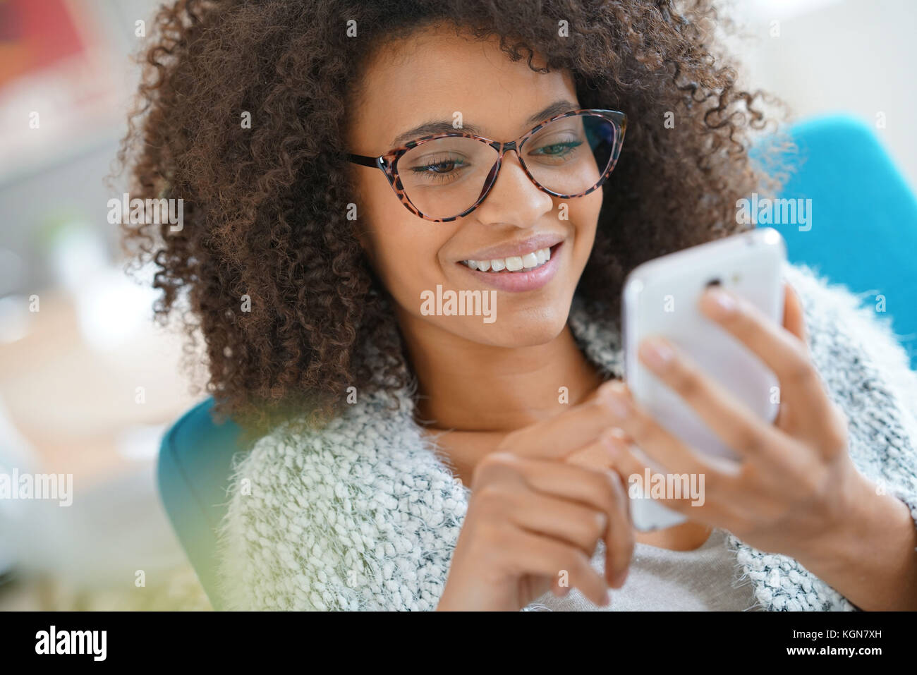 Woman relaxing at home and talking on phone Stock Photo - Alamy