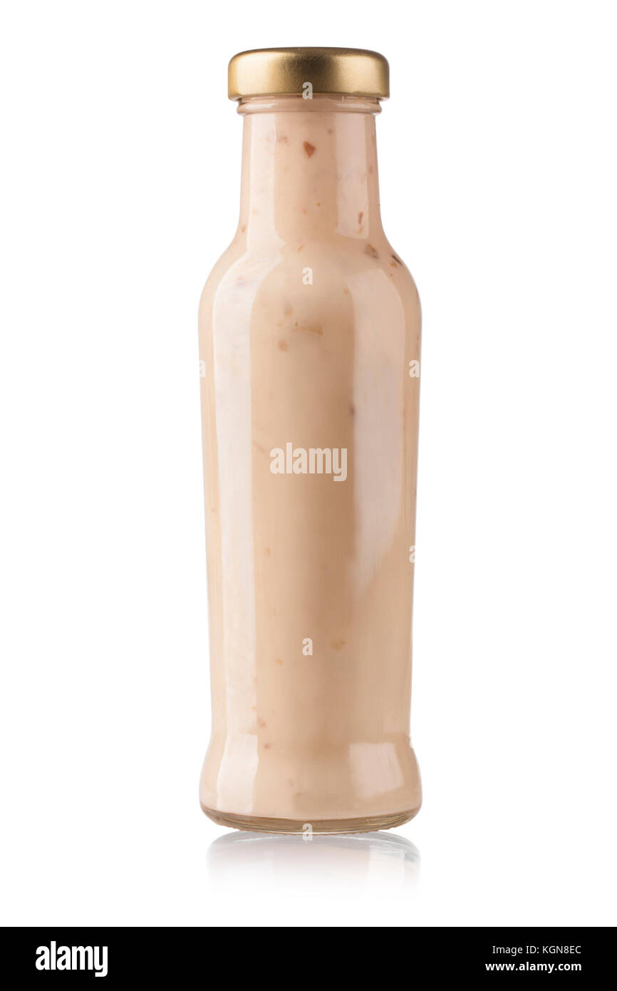 Glass bottle of white sauce. Isolated on a white background.With ...
