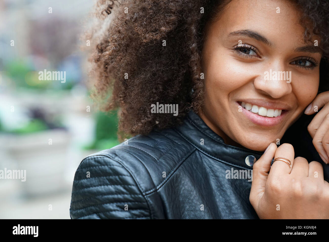 Portrait of mixed-raced girl in town Stock Photo - Alamy