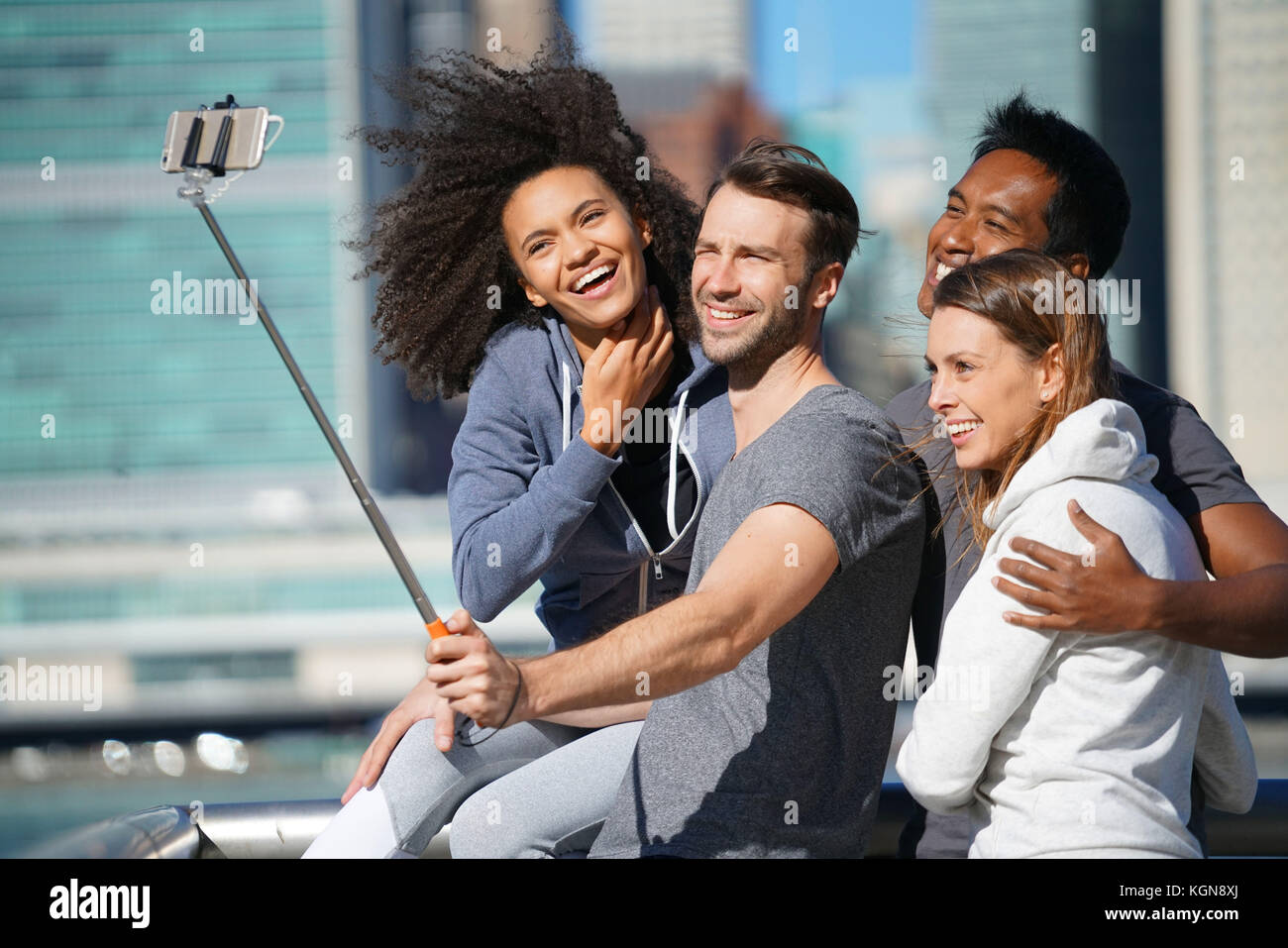 Group of friends taking selfie picture, Manhattan in background Stock ...