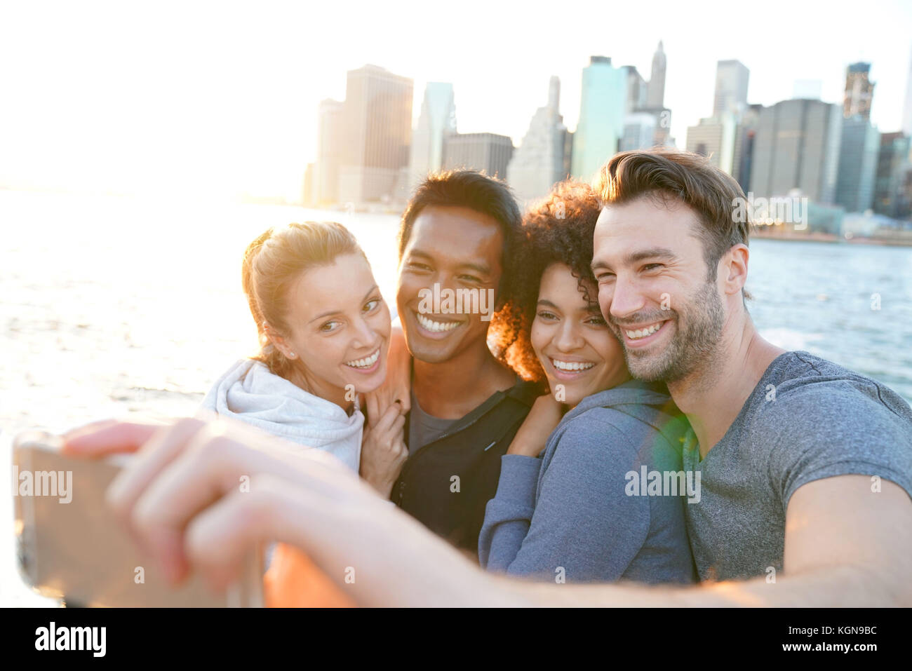 Friends taking selfie picture on Brooklyn heights promenade, NYC Stock ...