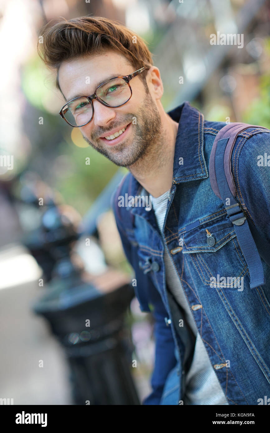 Cheerful man walking in the street, NYC tour Stock Photo - Alamy