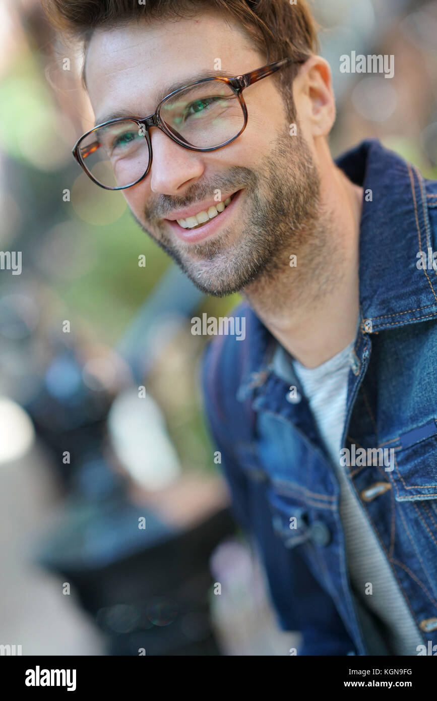 Cheerful man walking in the street, NYC tour Stock Photo - Alamy