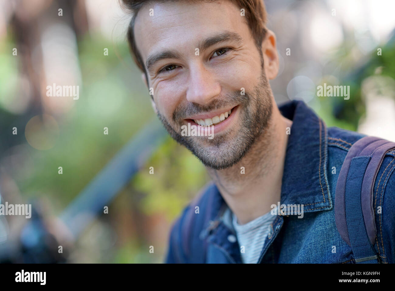 Cheerful man walking in the street, NYC tour Stock Photo - Alamy