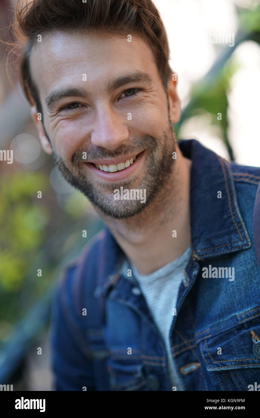 Cheerful man walking in the street, NYC tour Stock Photo - Alamy