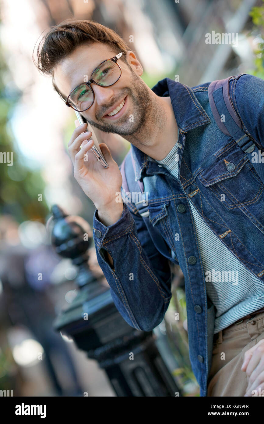 Cheerful man walking in the street, NYC tour Stock Photo - Alamy