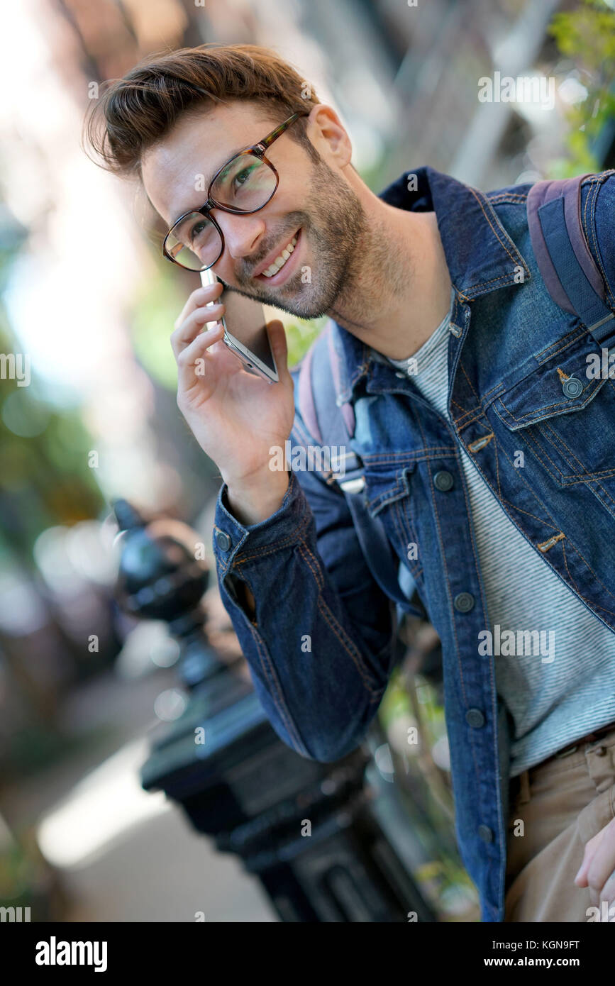 Cheerful man walking in the street, NYC tour Stock Photo - Alamy
