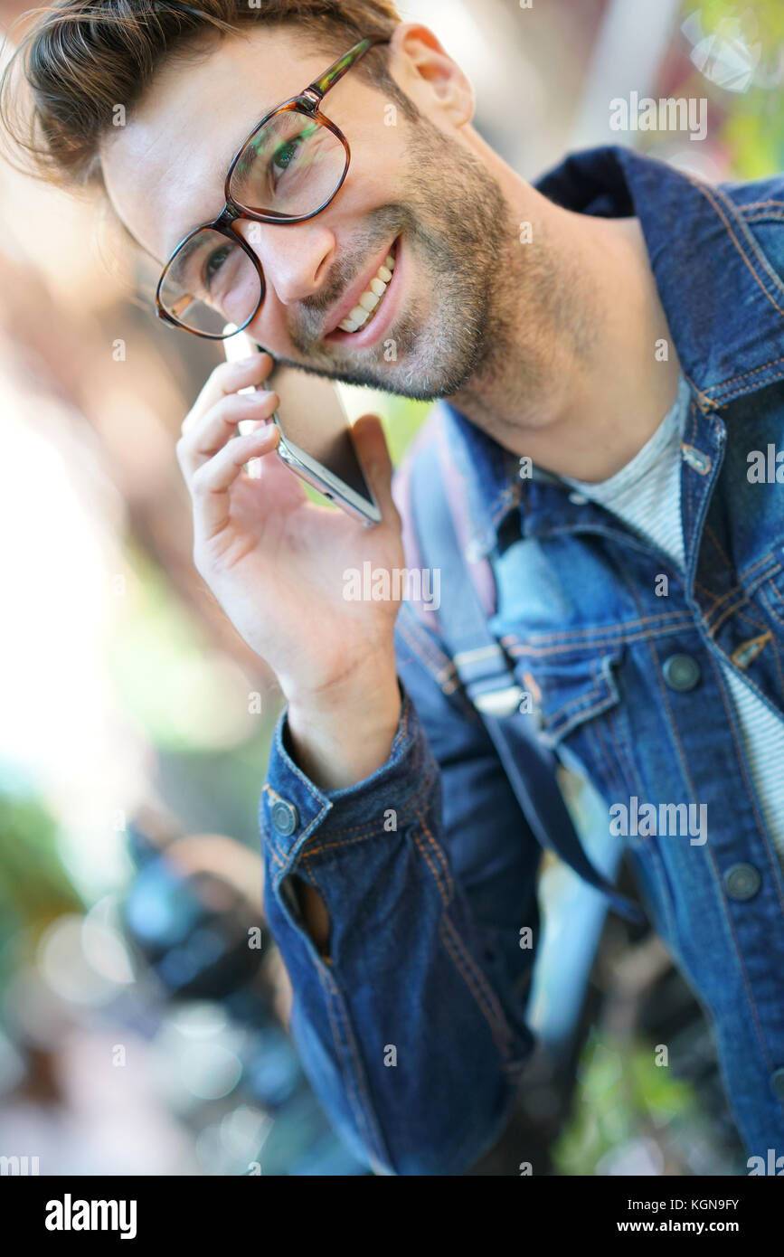 Cheerful man walking in the street, NYC tour Stock Photo - Alamy