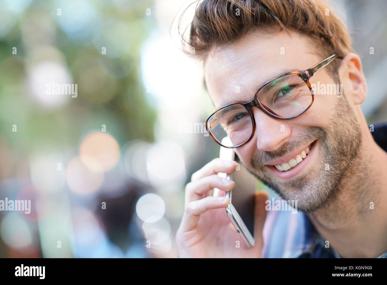 Cheerful man walking in the street, NYC tour Stock Photo - Alamy