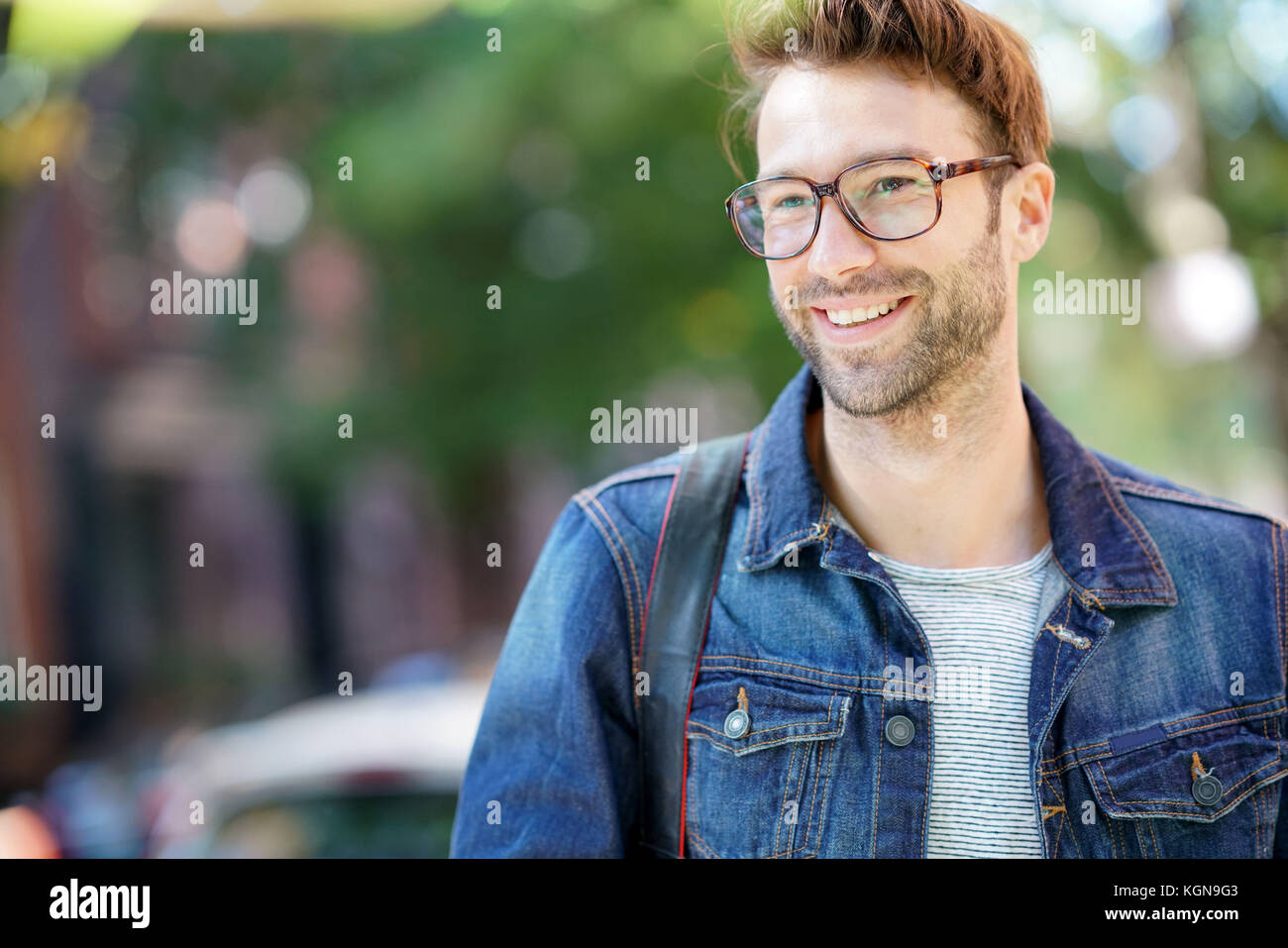 Cheerful man walking in the street, NYC tour Stock Photo - Alamy