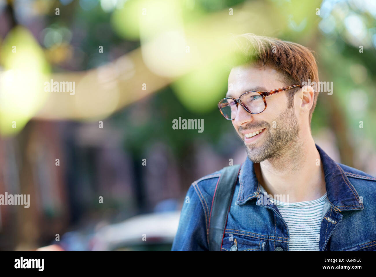 Cheerful man walking in the street, NYC tour Stock Photo - Alamy