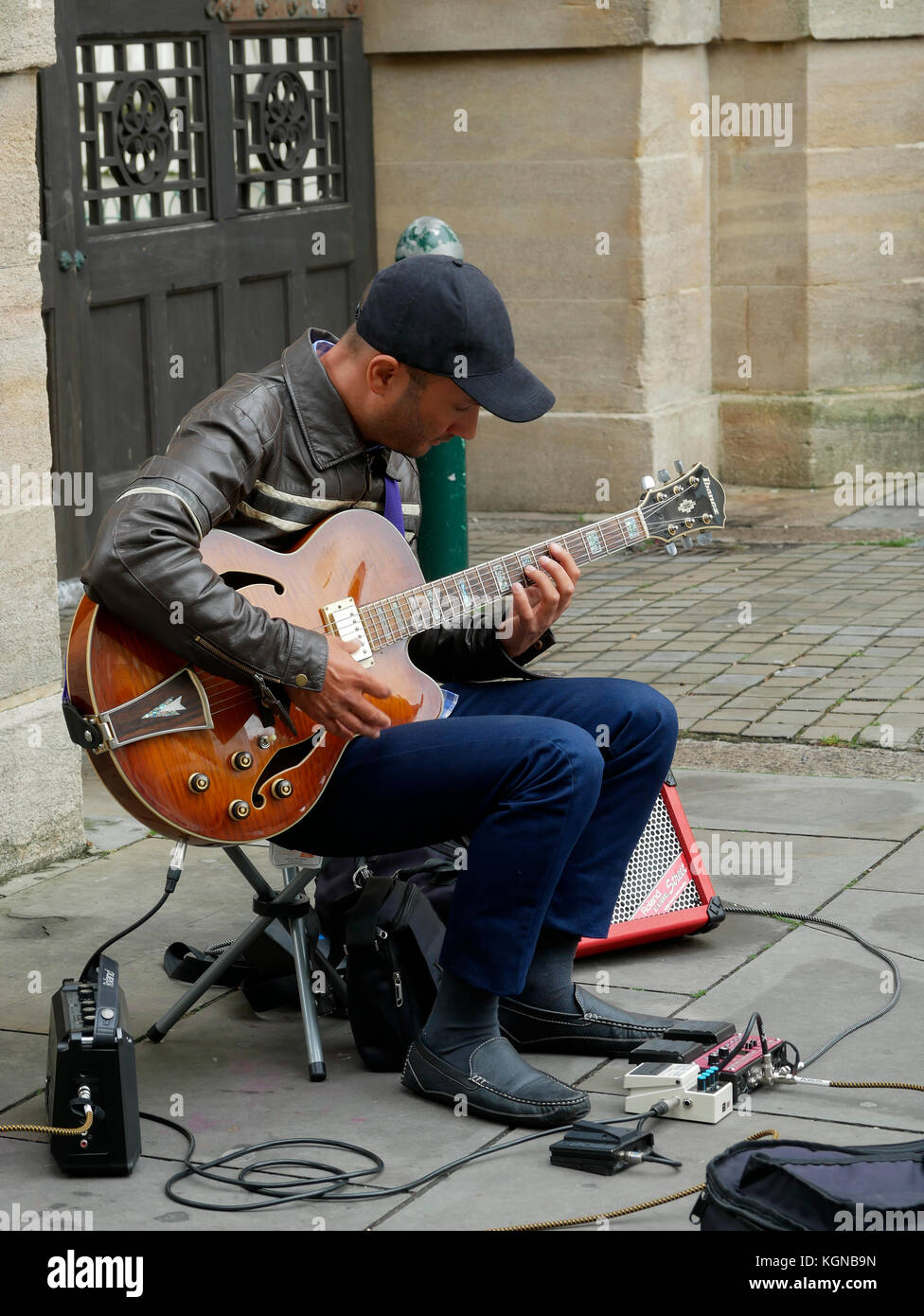 Man busking and playing guitar Brighton England Stock Photo - Alamy