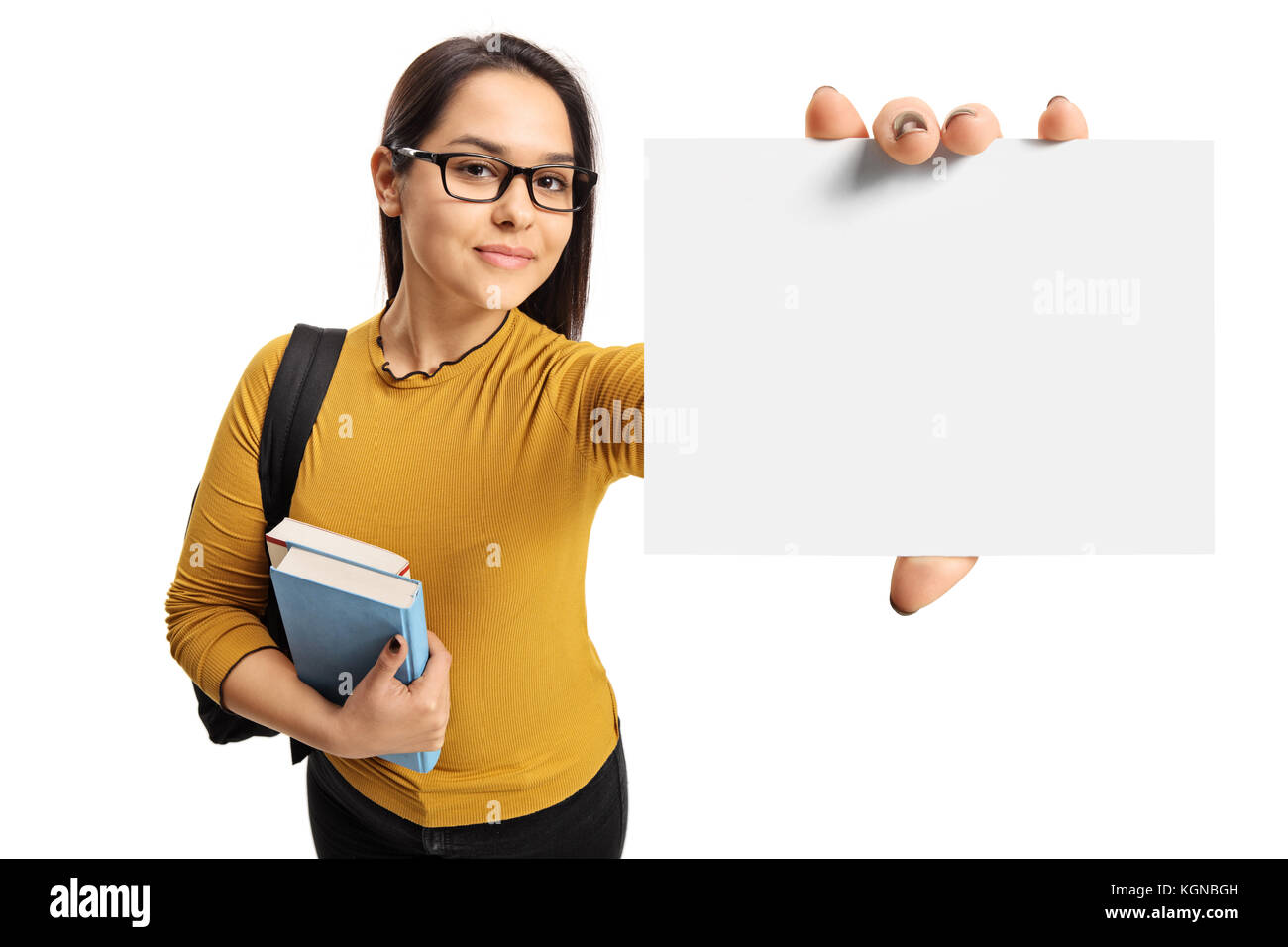 Female teenage student showing a blank card isolated on white ...