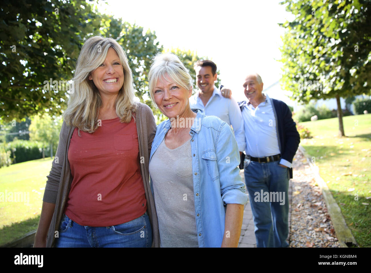 Family walk in park on sunday morning Stock Photo - Alamy
