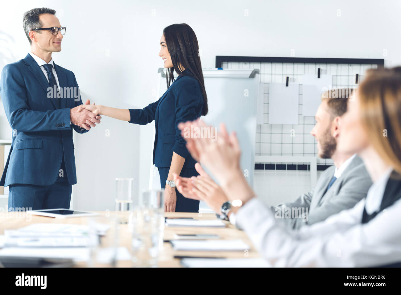 boss shaking hand of manageress Stock Photo - Alamy