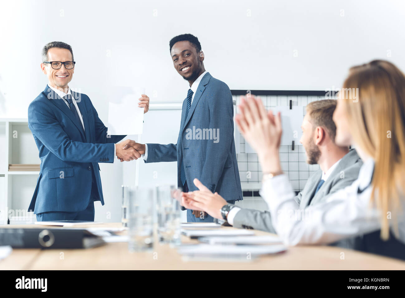 boss shaking hand of manager Stock Photo - Alamy