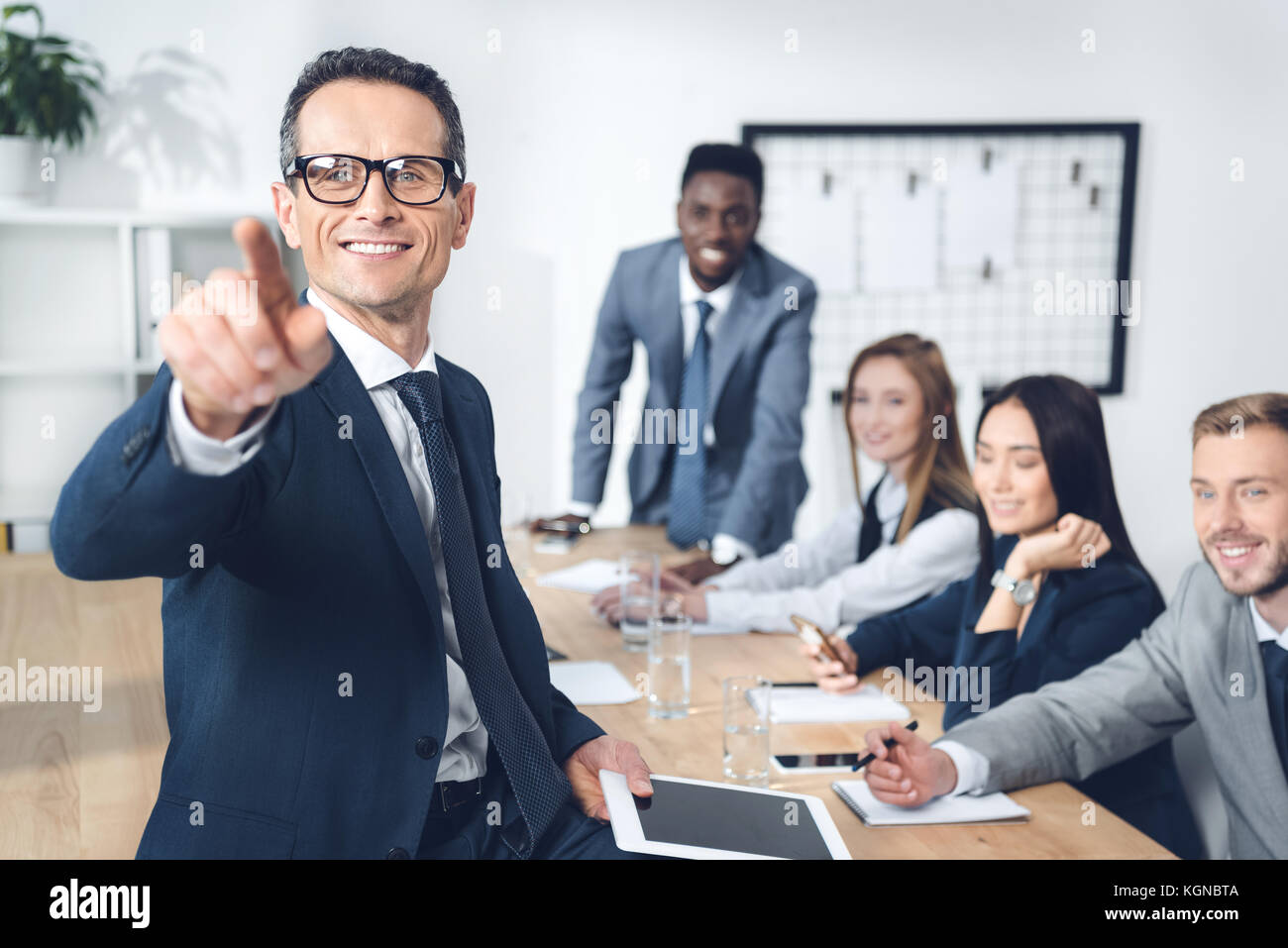 African businessman pointing camera working hi-res stock photography ...