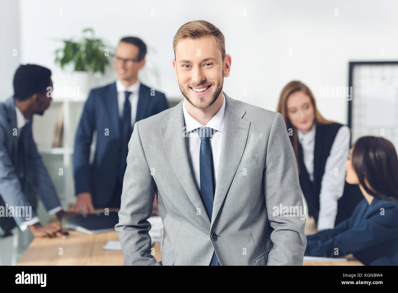 young manager looking at camera Stock Photo - Alamy