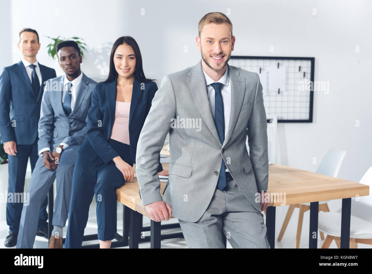 businesspeople posing in office Stock Photo - Alamy