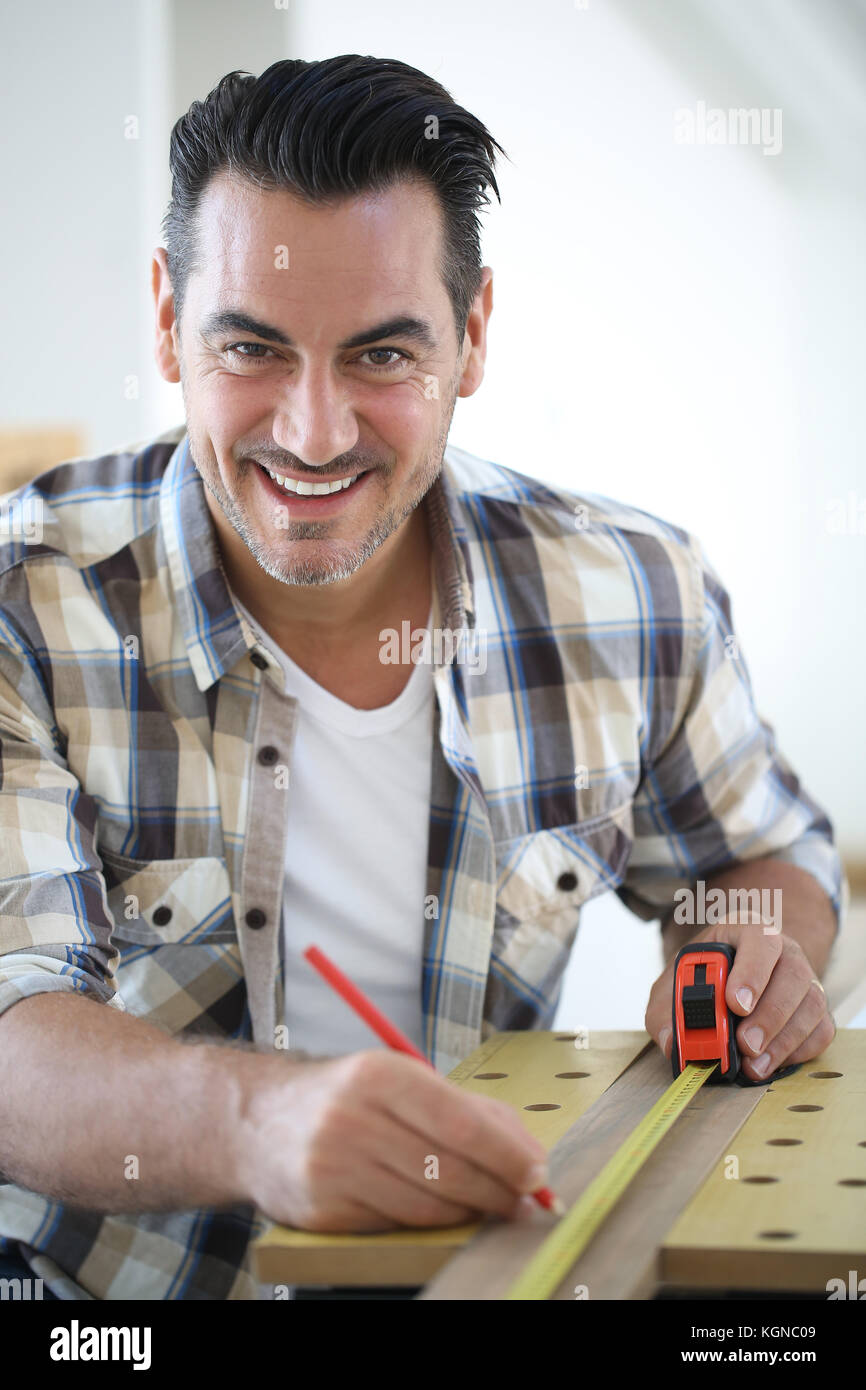 Portrait of man doing renovation work at home Stock Photo - Alamy