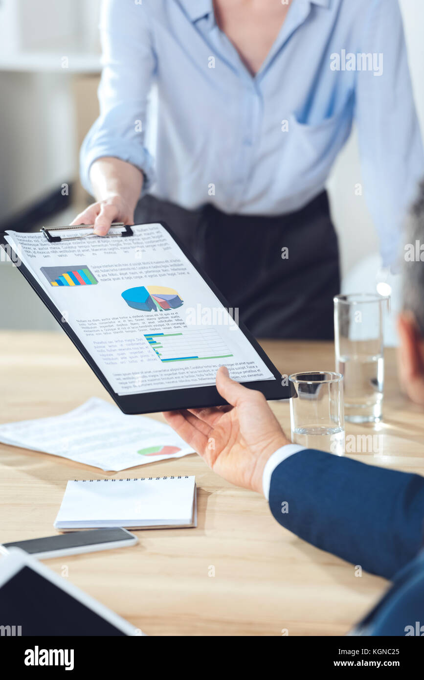 Male professional holding documents hi-res stock photography and images ...