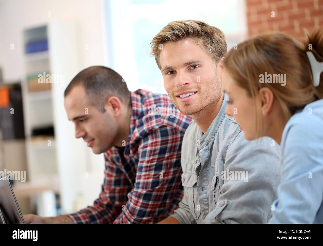 Portrait of smiling student gathering with friends Stock Photo - Alamy