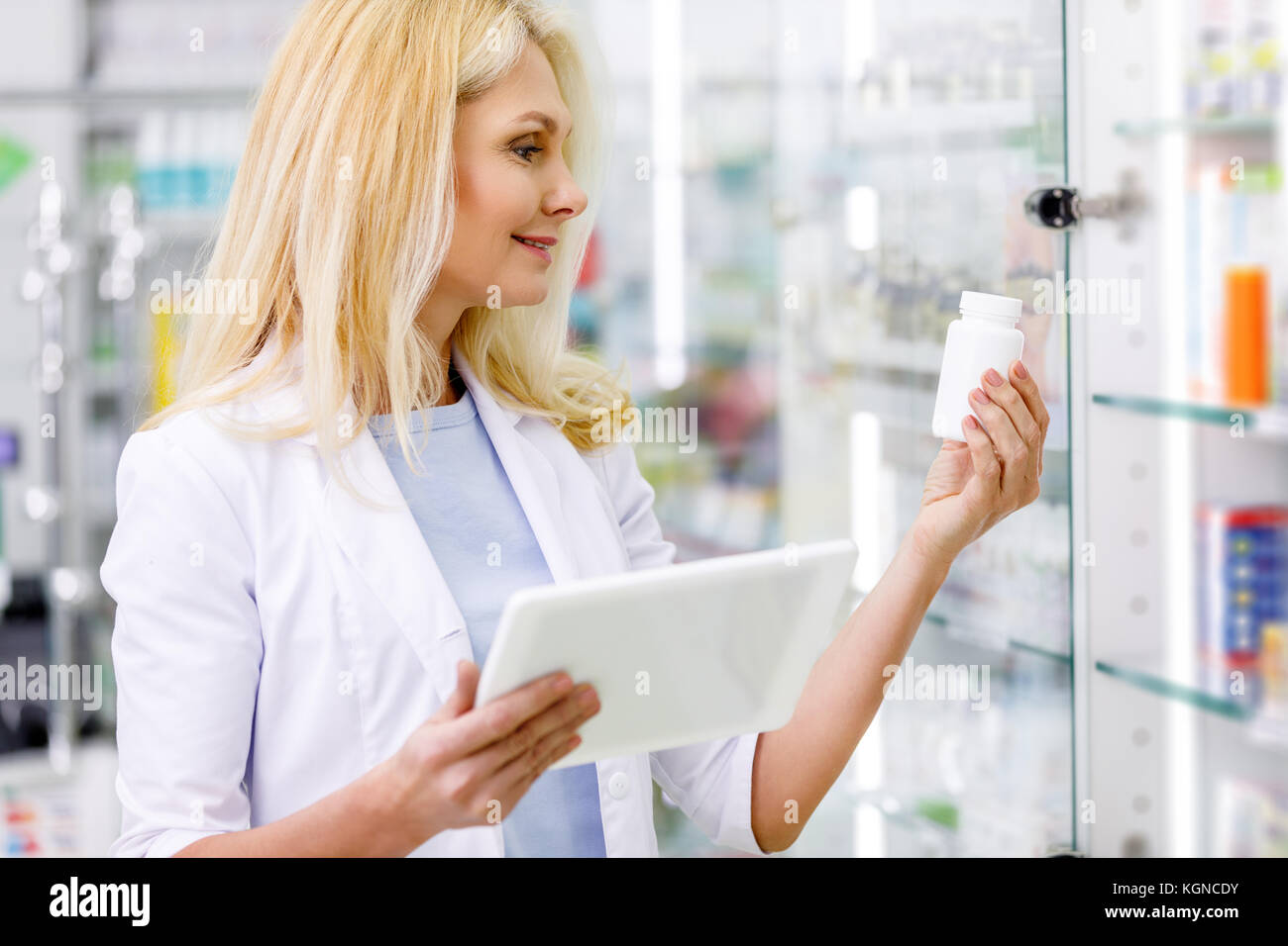 pharmacist with digital tablet and medication Stock Photo - Alamy