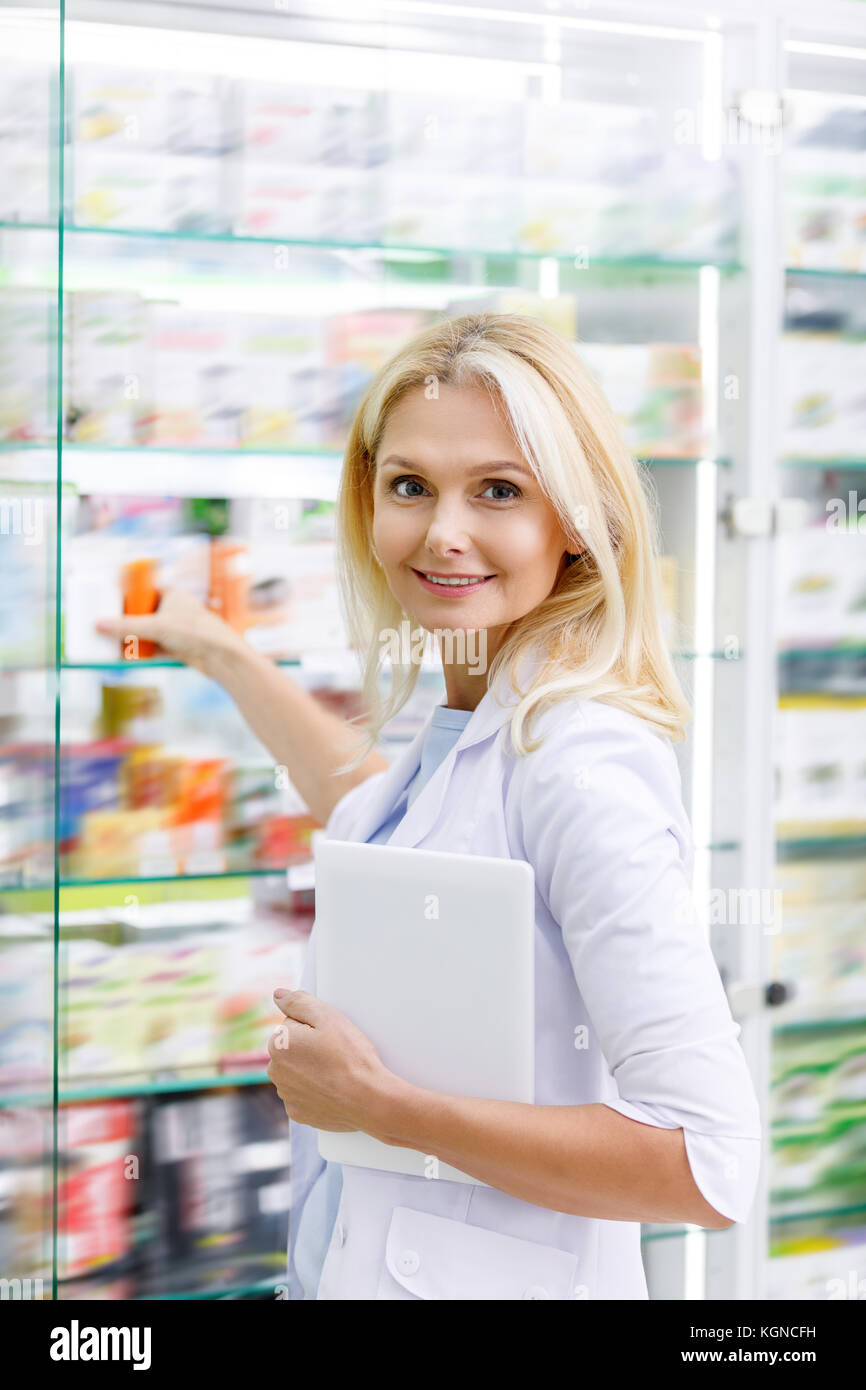 pharmacist with digital tablet in drugstore Stock Photo - Alamy