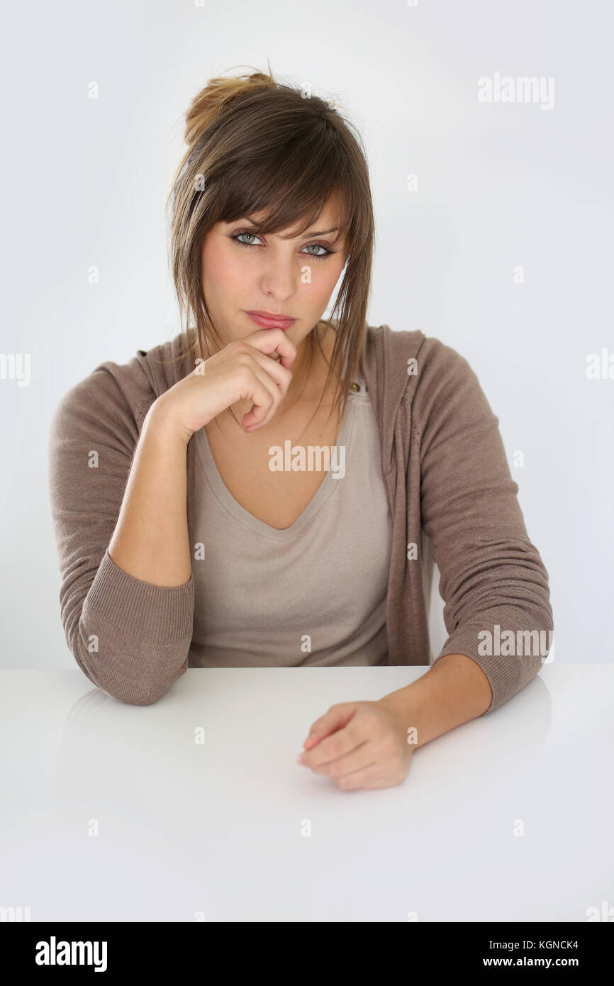 Portrait of young woman being skeptical, isolated Stock Photo - Alamy