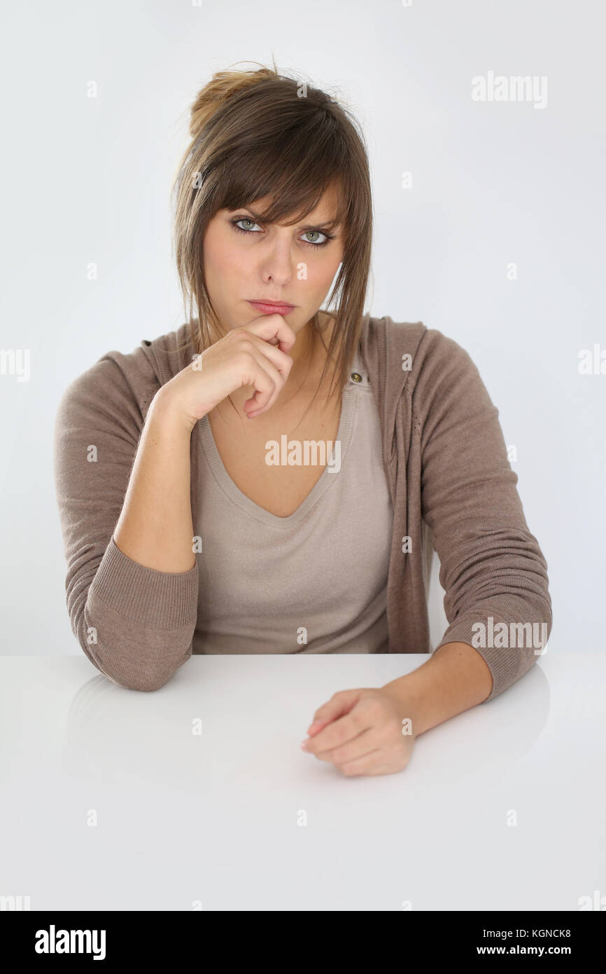 Portrait of young woman being skeptical, isolated Stock Photo - Alamy
