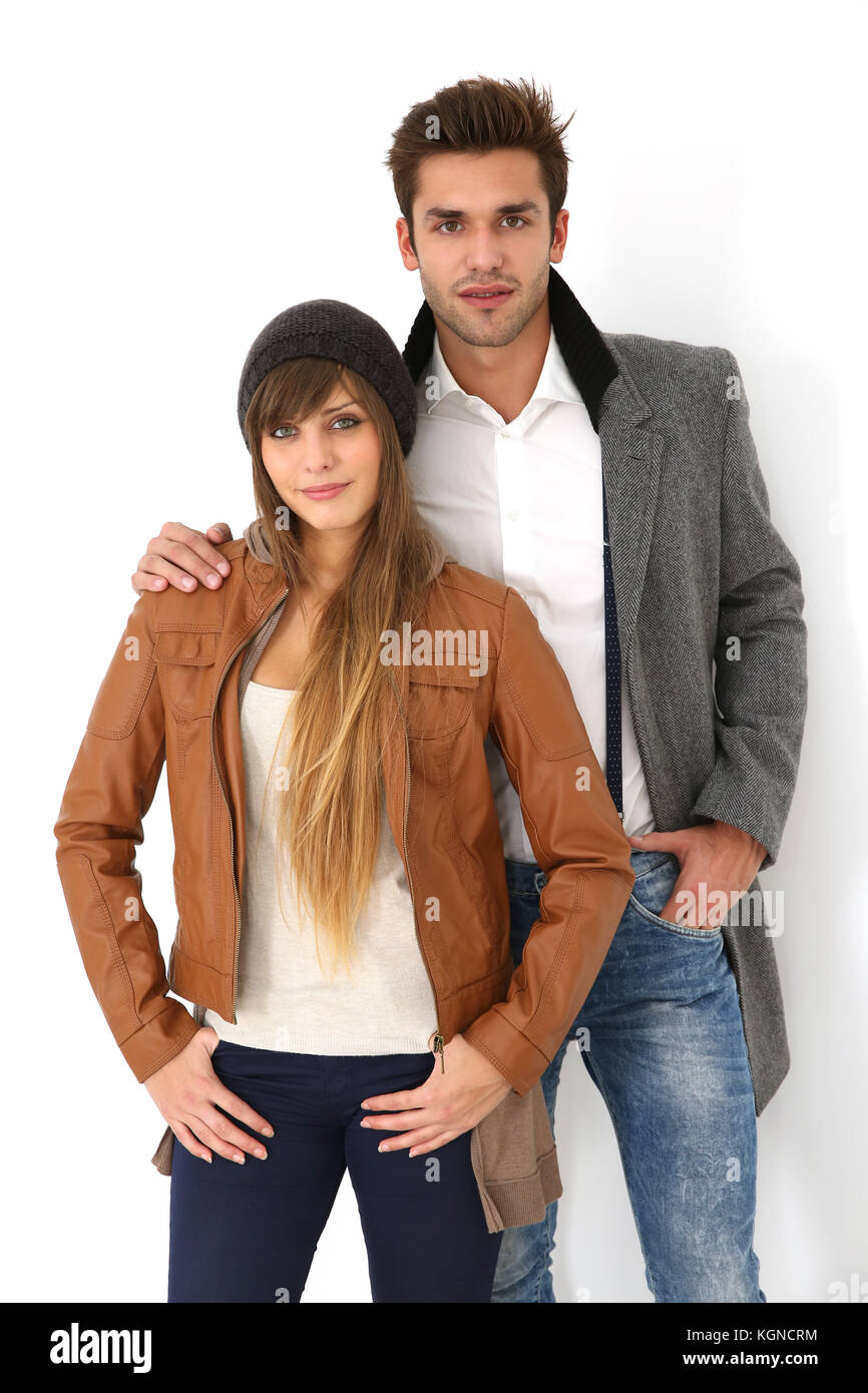 Trendy couple of lovers standing on white background Stock Photo - Alamy