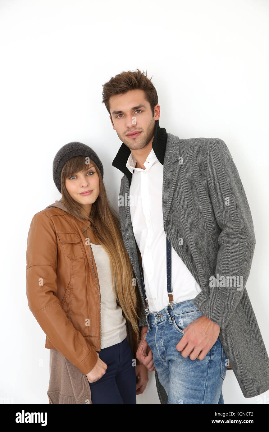 Trendy couple of lovers standing on white background Stock Photo - Alamy
