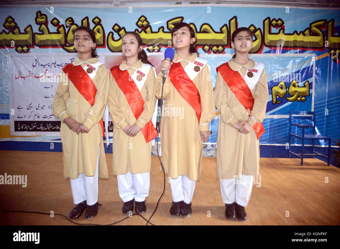 Students perform tableau on stage during ceremony on the occasion of ...