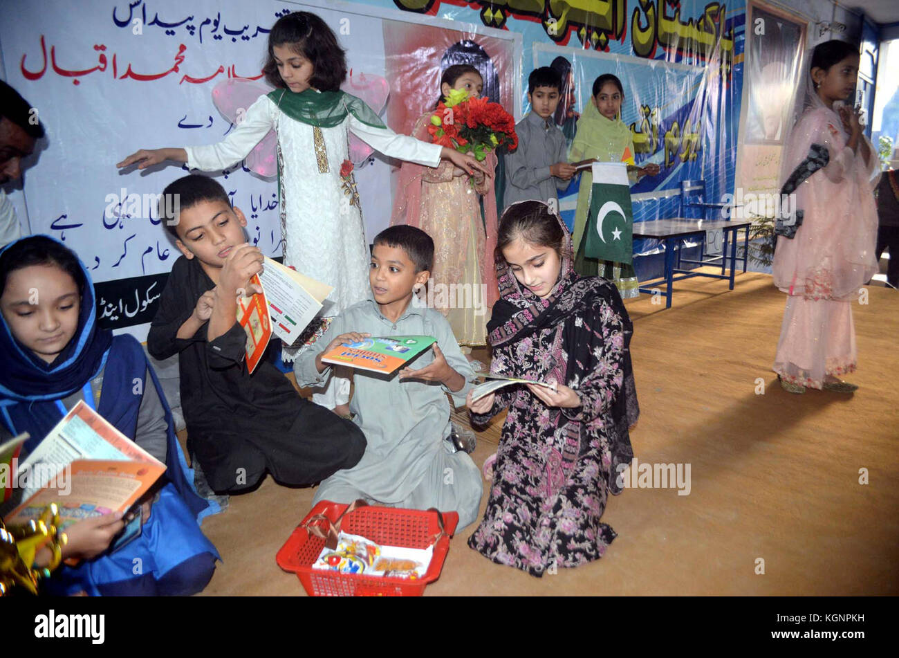 Students perform tableau on stage during ceremony on the occasion of ...