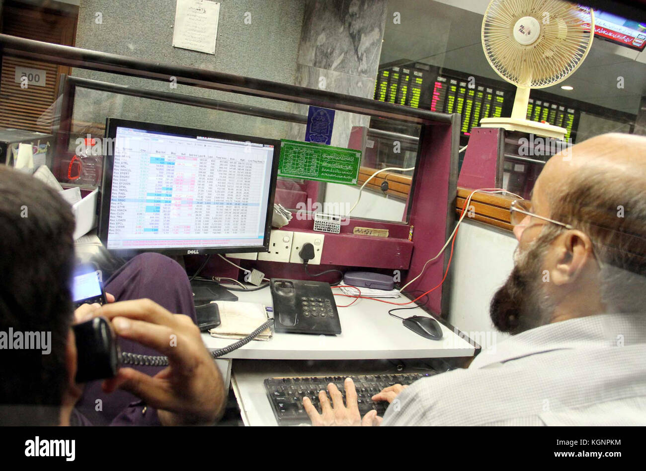 Stock brokers are busy in trading at Pakistan Exchange in Karachi on ...