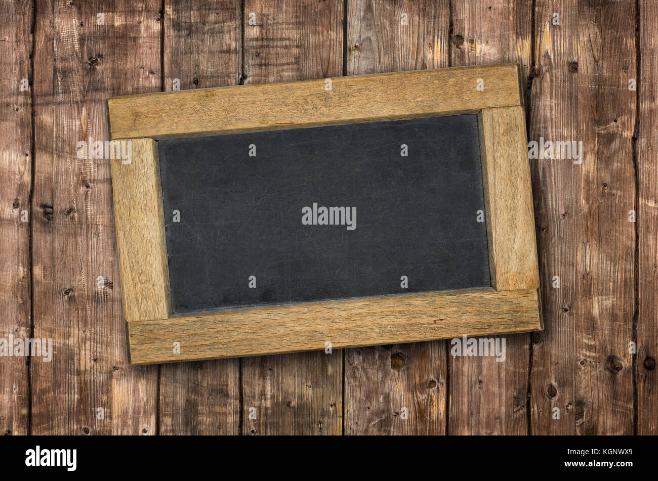 Old blackboard on rustic wooden background Stock Photo - Alamy