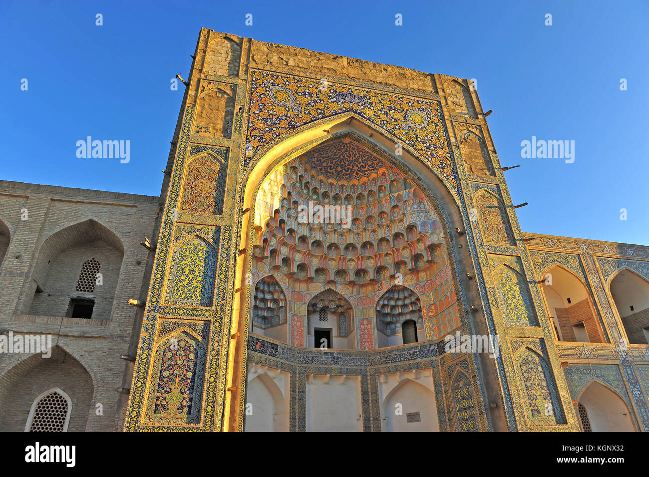 Bukhara: medieval Madrasa gate on sunset Stock Photo - Alamy