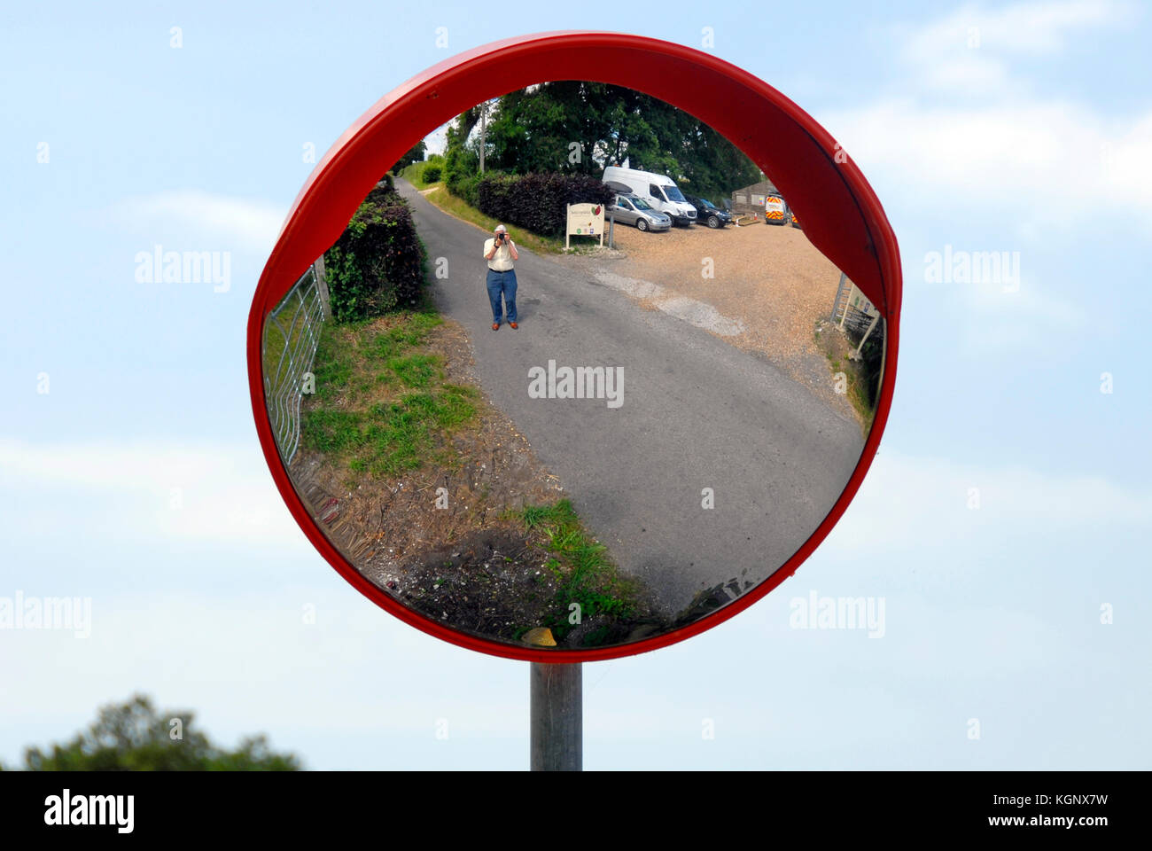 Reflection in road-side safety mirror Stock Photo - Alamy