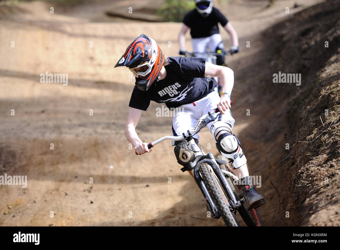 Mountain biking at Chicksands, Bedfordshire. Riders descending down a ...