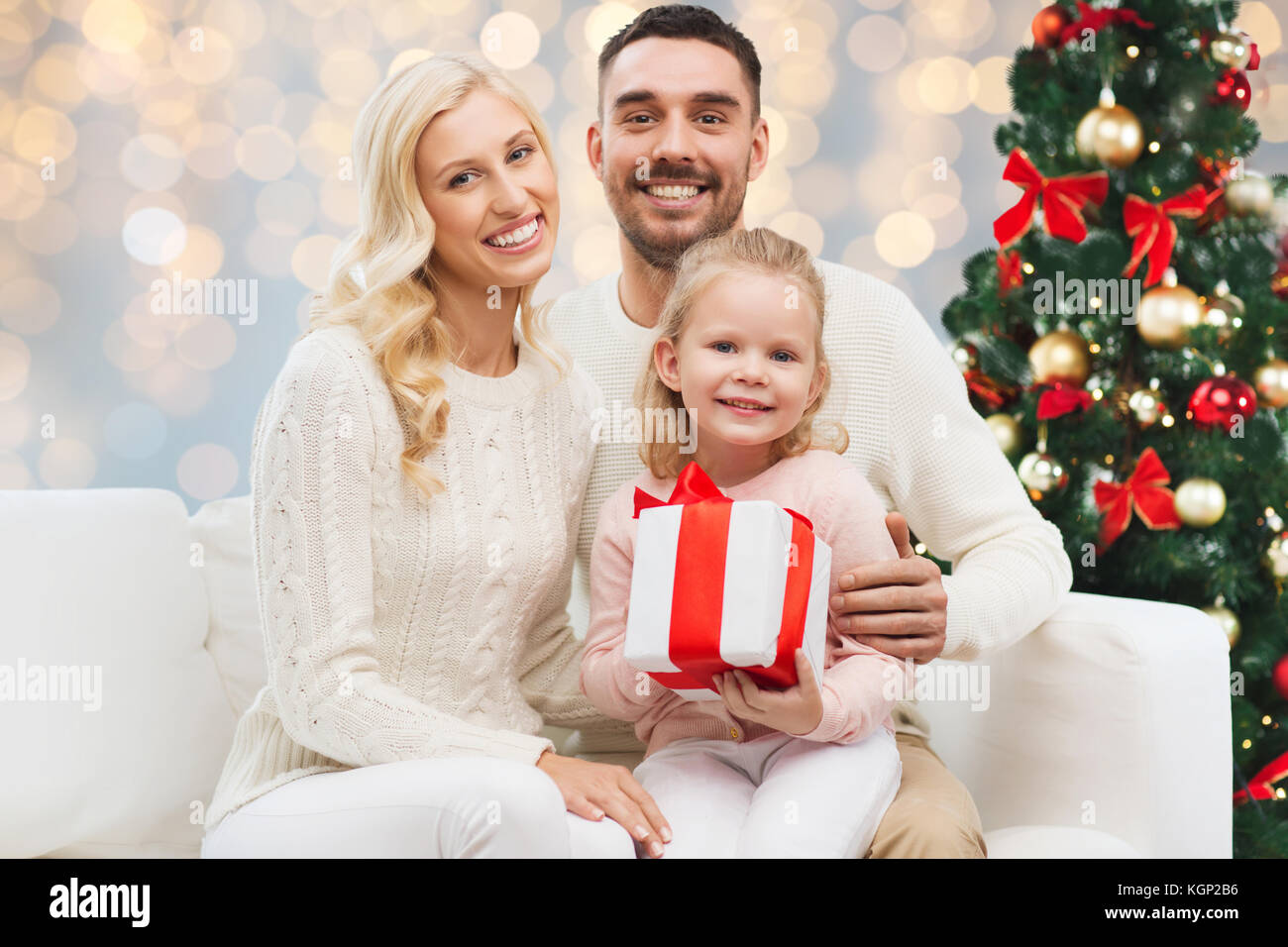 happy family with christmas gift Stock Photo - Alamy
